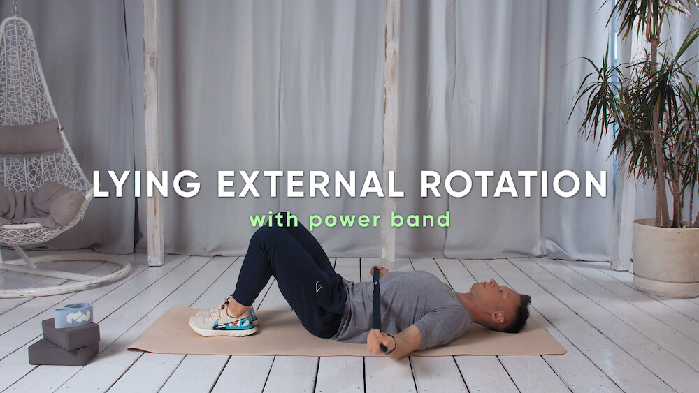 Lying external rotation with power band | Atlas ćwiczeń | Centrum Respo